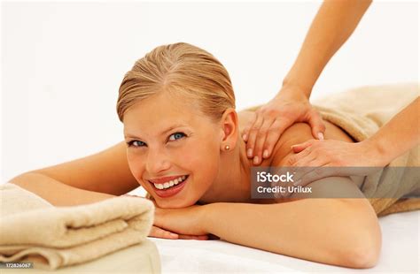 Portrait Of A Happy Cute Woman Relaxing While Getting A Massage Stock
