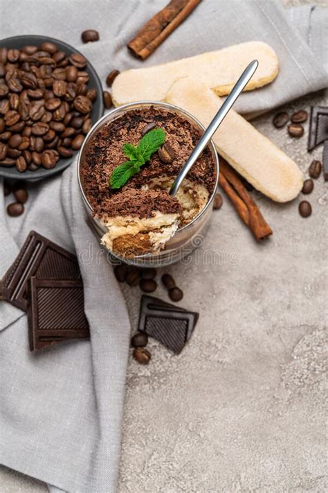 Classic Tiramisu Dessert In A Glass Cup Pieces Of Chocolate And