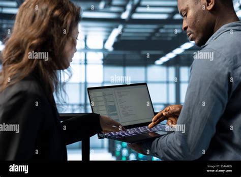 Notebook Used By Data Center Software Developers Reviewing Equipment