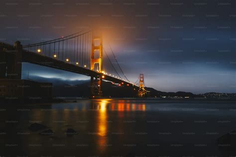 The Golden Gate Bridge Is Lit Up At Night Photo City Image On Unsplash
