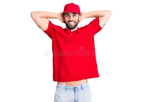 Young Handsome Man With Beard Wearing Delivery Uniform Relaxing And
