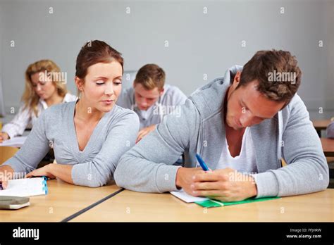 Female Babe Trying To Cheat At Test In Class Stock Photo Alamy