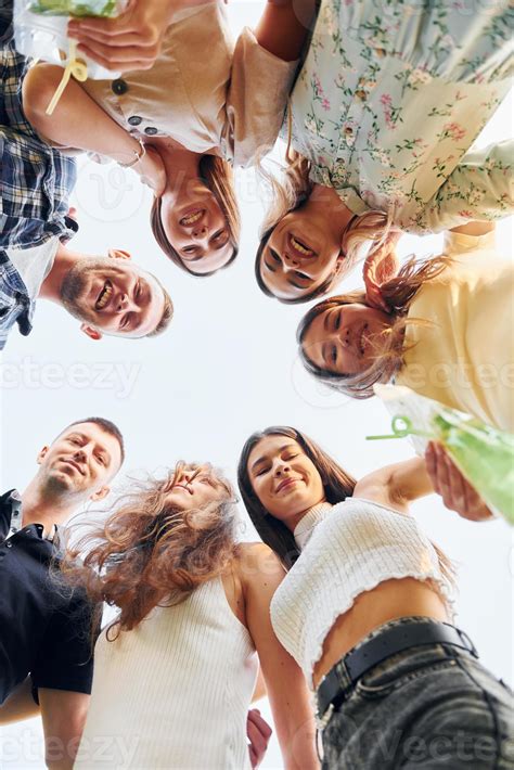 View From Below Of Young Positive People That Looking Down 15459984
