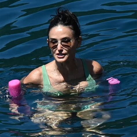 Demi Moore Shows Off Her Chic Curves In A Tiny Green Swimsսit Basking