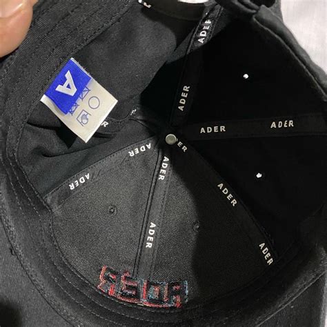 ader error ader logo hats fesyen pria aksesoris topi di carousell