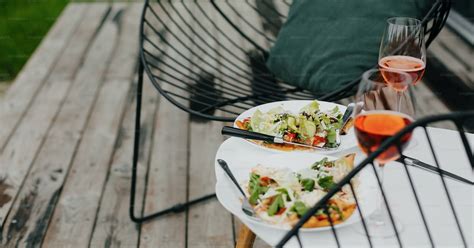 Homemade Pizza And Aperol Drink On Modern Wooden Terrace Dinner For Two Delicious Pizza And