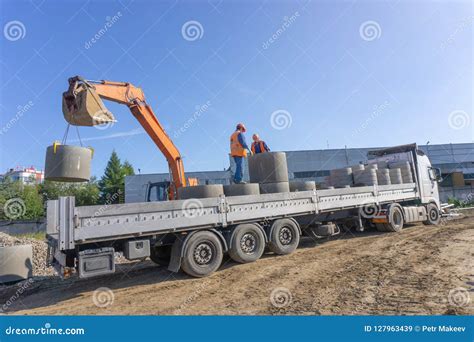 Elements Of The Pipeline Are At A Construction Site On The Background Of The Process Of Assembly