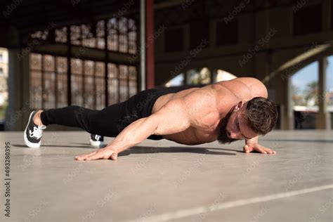 Shirtless Man Doing Push Ups On Street Stock Photo Adobe Stock