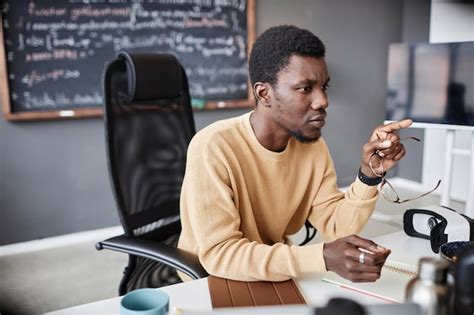 Premium Photo African American Programmer Working On Computer At His Workplace In It Office