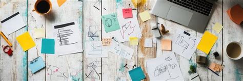 Engaging Brainstorming Activity With Sticky Notes Sketches And Design Elements In A Creative