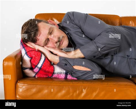 Man Laying On Couch And Resting Stock Photo Alamy