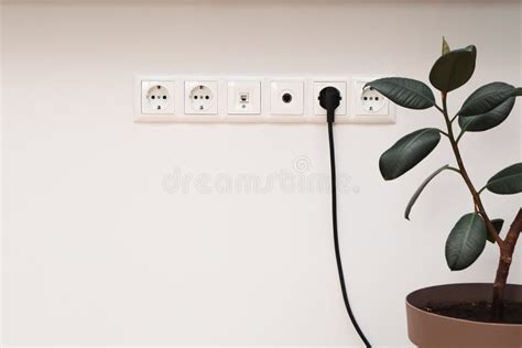 An Electrical Socket In The Wall In The Apartment Of The House Black