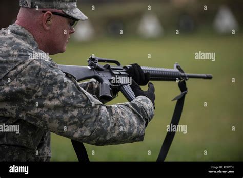 A U S Army Reserve Soldier Locks And Loads A Magazine Into His M16a2