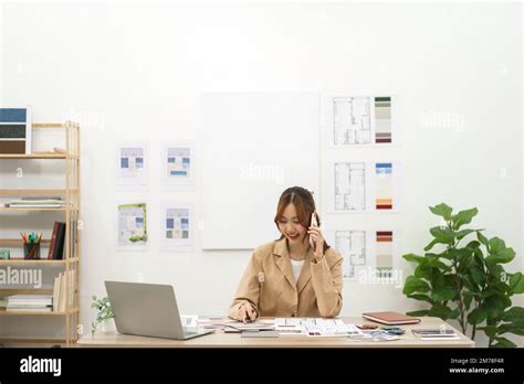Architecture Concept Female Architect Designing House Interior And Talking With Client On Phone