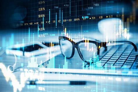 Financial Graph With Candlesticks And Data Overlays On Laptop And Glasses Stock Image Image Of