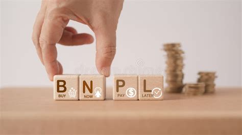 Hand Arranged Wooden Cube Blocks With Bnpl Alphabets Abbreviation And Icon With Blurred Stack