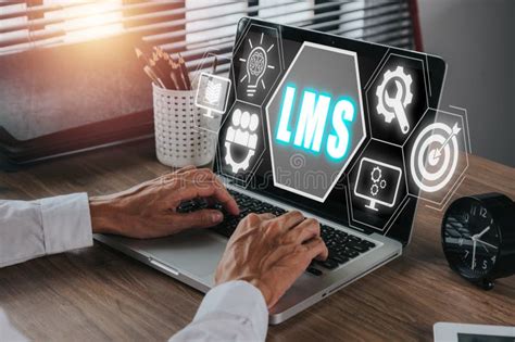 business person using laptop computer with lms icon on virtual screen