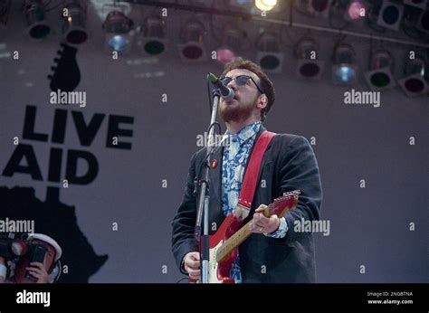 Singer Elvis Costello Performs At Live Aid Concert For Famine Relief At