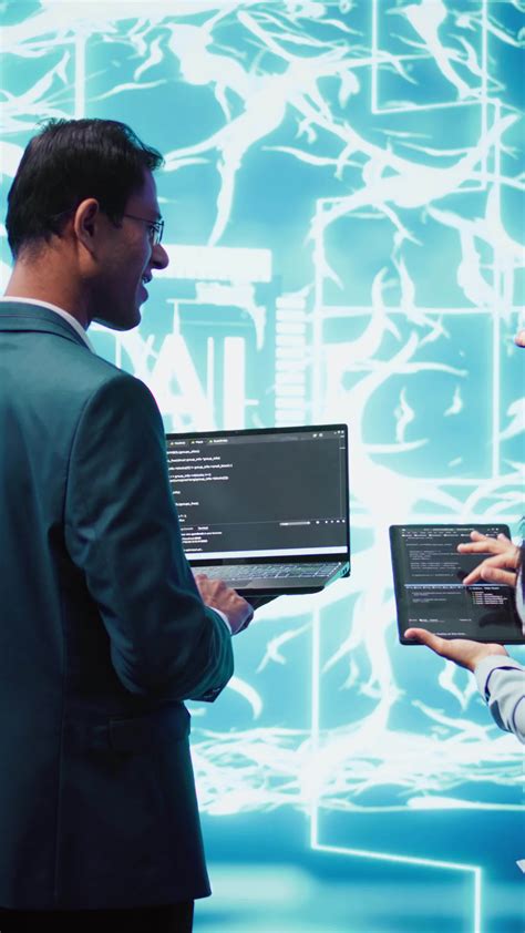 Vertical Team Of Admins Using Tablet And Laptop To Maintenance Artificial Intelligence Neural