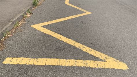 What Do Yellow Zig Zag Lines On The Road Mean And Can I Be Fined For Parking On Them The