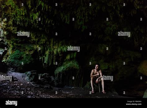 Man Exploring Natural Cave Systems In Fiji Stock Photo Alamy