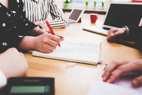 Woman Taking Notes With Pen And Paper In Meeting Stock Photo Image Of Meeting Business