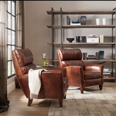 Luxury Living Room With Leather Club Chairs And Bookshelf