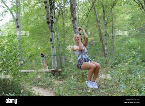 Climber Girl Engaged In Training Between Trees Stock Photo Alamy