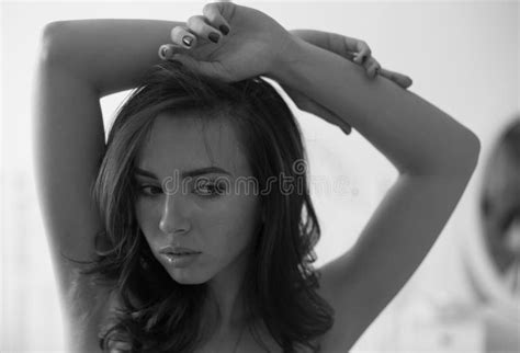 Beautiful And Brunette Young Woman Wearing Black Lingerie In Bed