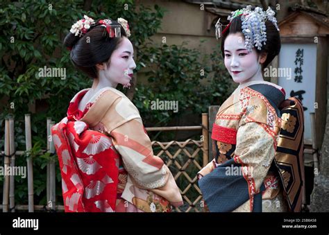 Two Female Tourists Dressed Up Like Maiko Apprentice Geisha Walking