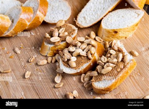 Wheat Fresh Baguette And Peanut Paste Making Breakfast Of Bread And Peanut Butter With Pieces