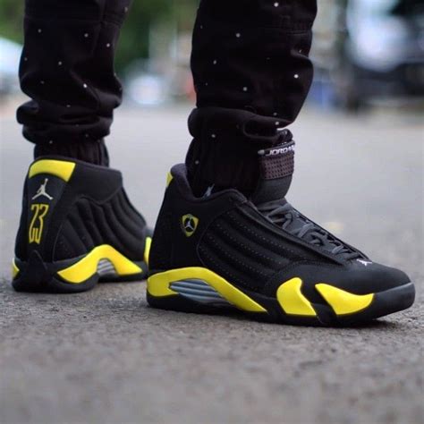 Jordan 14 Black And Yellow On Feet