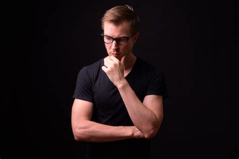 Premium Photo Portrait Of Stressed Young Nerd Man With Eyeglasses