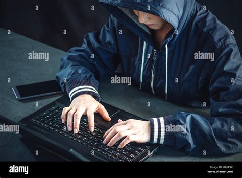 Hacker Teen Programmer Uses A Laptop To Hack The System Stealing