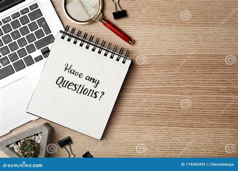 Notebook With Phrase Have Any Questions And Laptop On Table Flat Lay