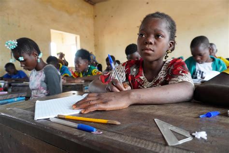 Diatou An Out Of School Girl Takes A Seat In The Classroom Plan International Mali