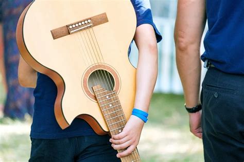 How To Hold A Guitar Master Proper Posture And Position