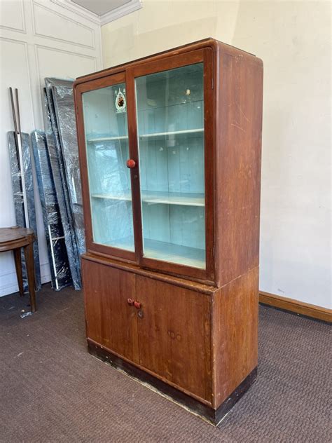 ตู้โชว์ 2 บานเปิดกระจก 2 บานเปิดทึบ โครงไม้สักปิดหลังไม้อัด 777 เฟอร์นิเจอร์ เฟอร์นิเจอร์