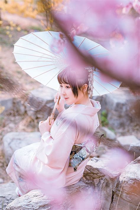 Girl In Kimono During The Daytime Outdoors Under The Cherry Blossoms