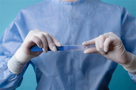 Free Photo Female Doctor Holding Metallic Medical Scalpel
