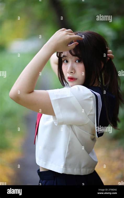 Japanese High School Student Tied Her Hair Up In Park With Tree