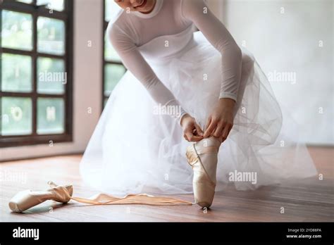 Ballerina In Ballet Shoes Asian GirlÂ Tying Ribbons Of Toe Shoes Ballet Dancer Preparing And