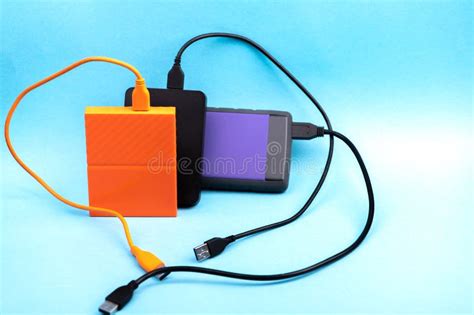 Three External Portable Hard Disk Drives Isolated On Light Blue Stock Image Image Of Hard