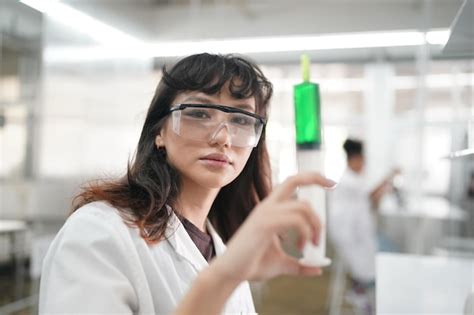 Premium Photo Young Scientist In White Lab Coat Working With Binocular Microscope In The