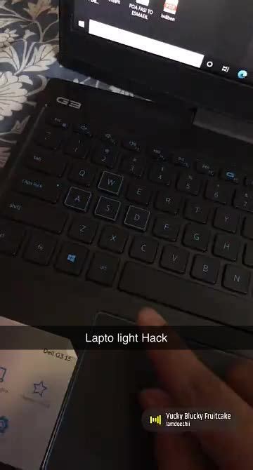 A Person Is Typing On Their Laptop Keyboard