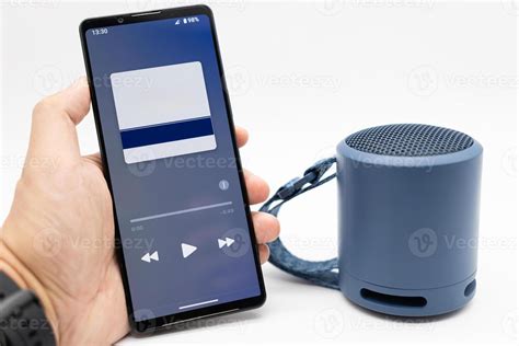 Hand Using Phone Connecting Portable Speaker Using Bluetooth Speaker With Smart Phone 45595760