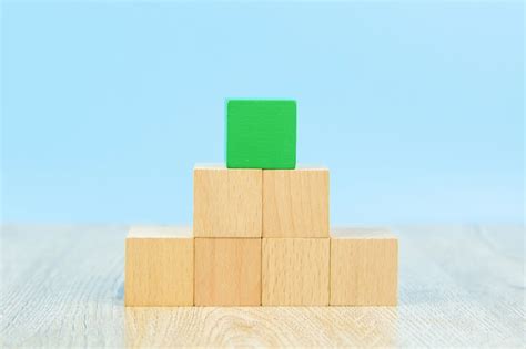 Premium Photo Wooden Block Toy Stacked In Pyramid Shape