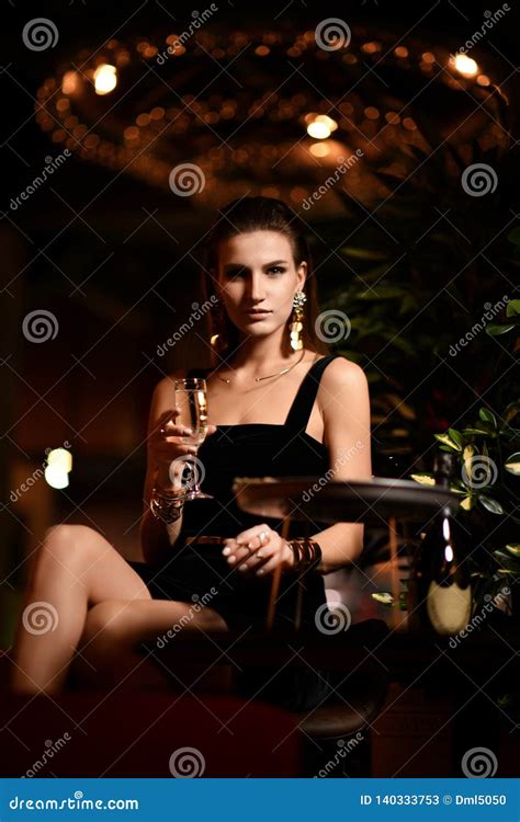 Beautiful Fashion Brunette Woman In Bar Restaurant Relaxing Drinking