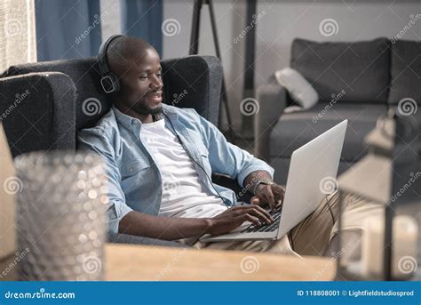 Handsome African American Man Wearing Headphones Using Laptop Stock Image Image Of Daytime