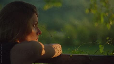 Portrait Of Woman Looking Nature At Sunset By Stocksy Contributor